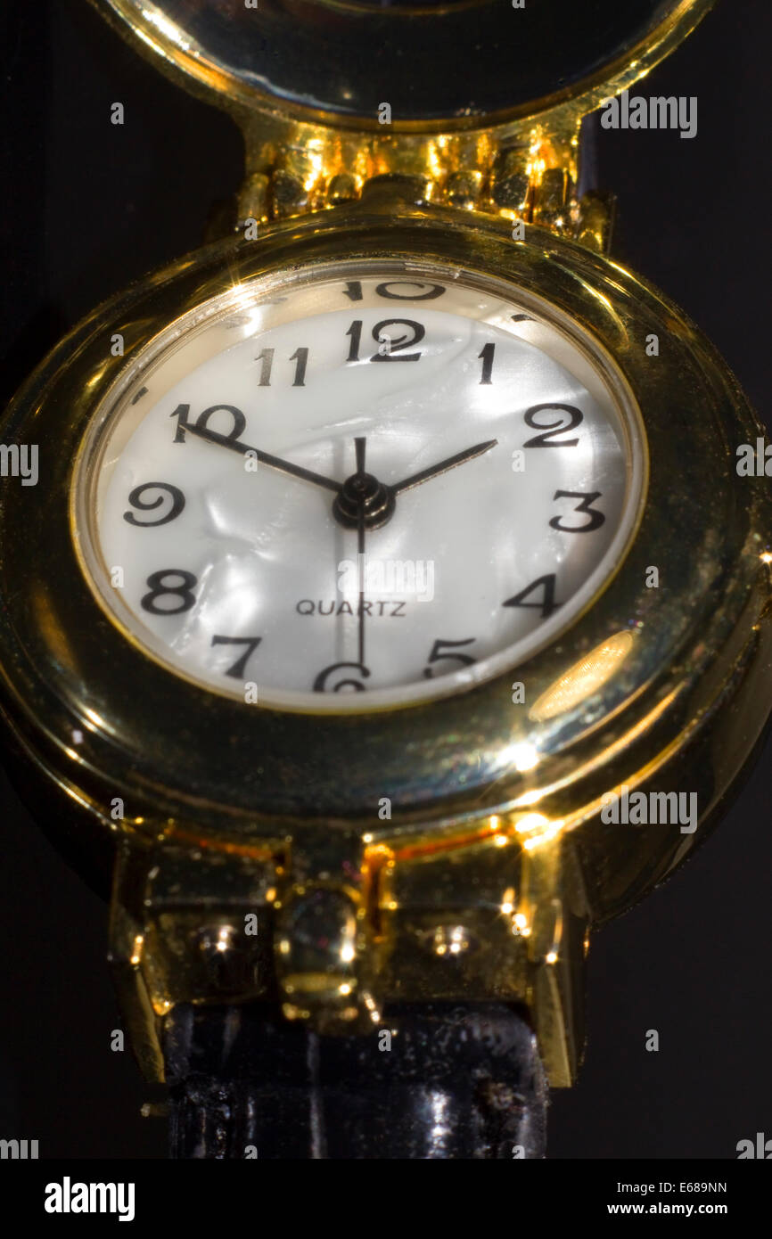 circular dial of a goldplated watch Stock Photo - Alamy