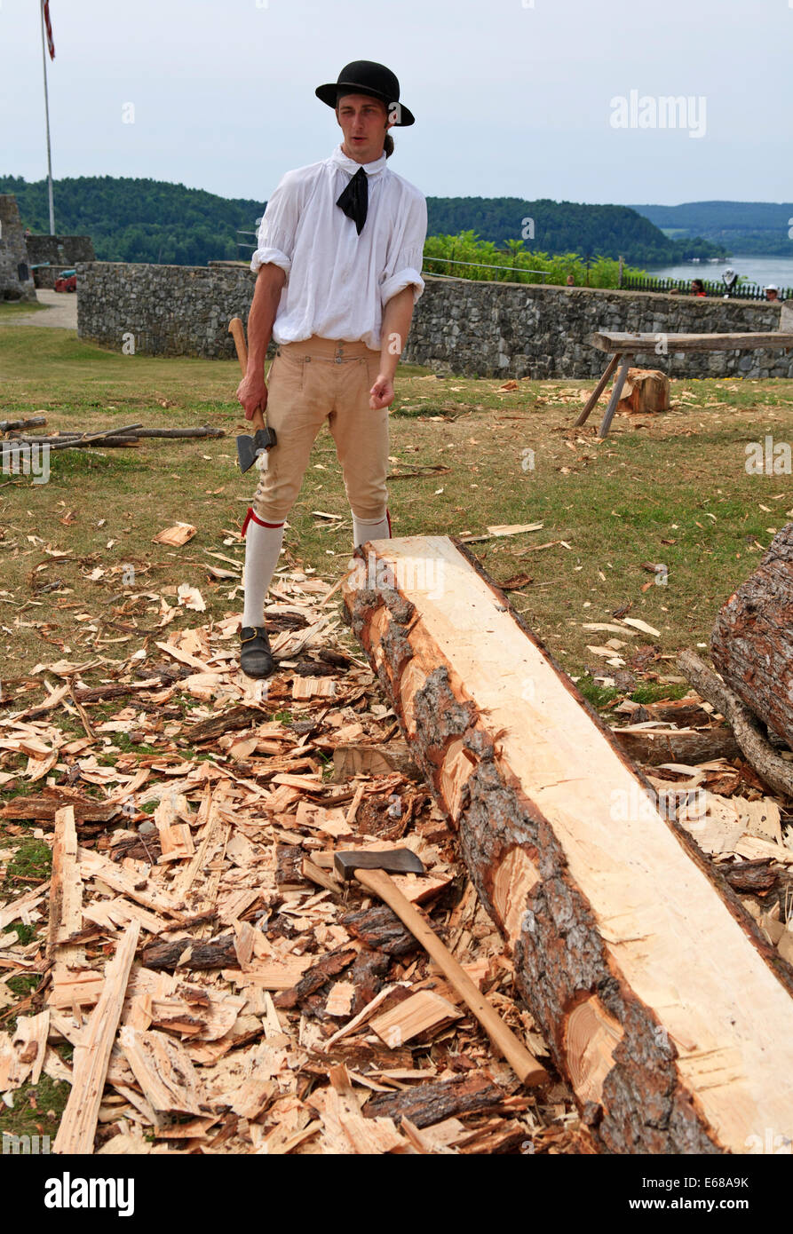 Man preparing logs for use in traditional building techniques Stock ...