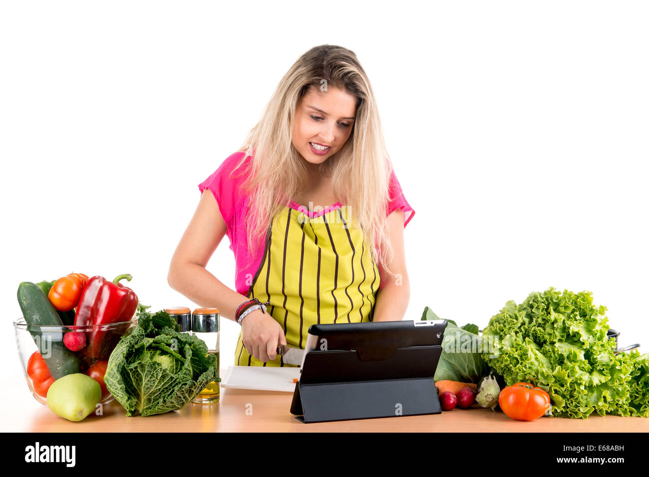 Beautiful woman cooking with tablet for recipes Stock Photo - Alamy