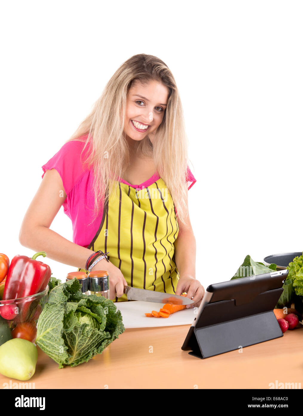 Beautiful woman cooking with tablet for recipes Stock Photo - Alamy