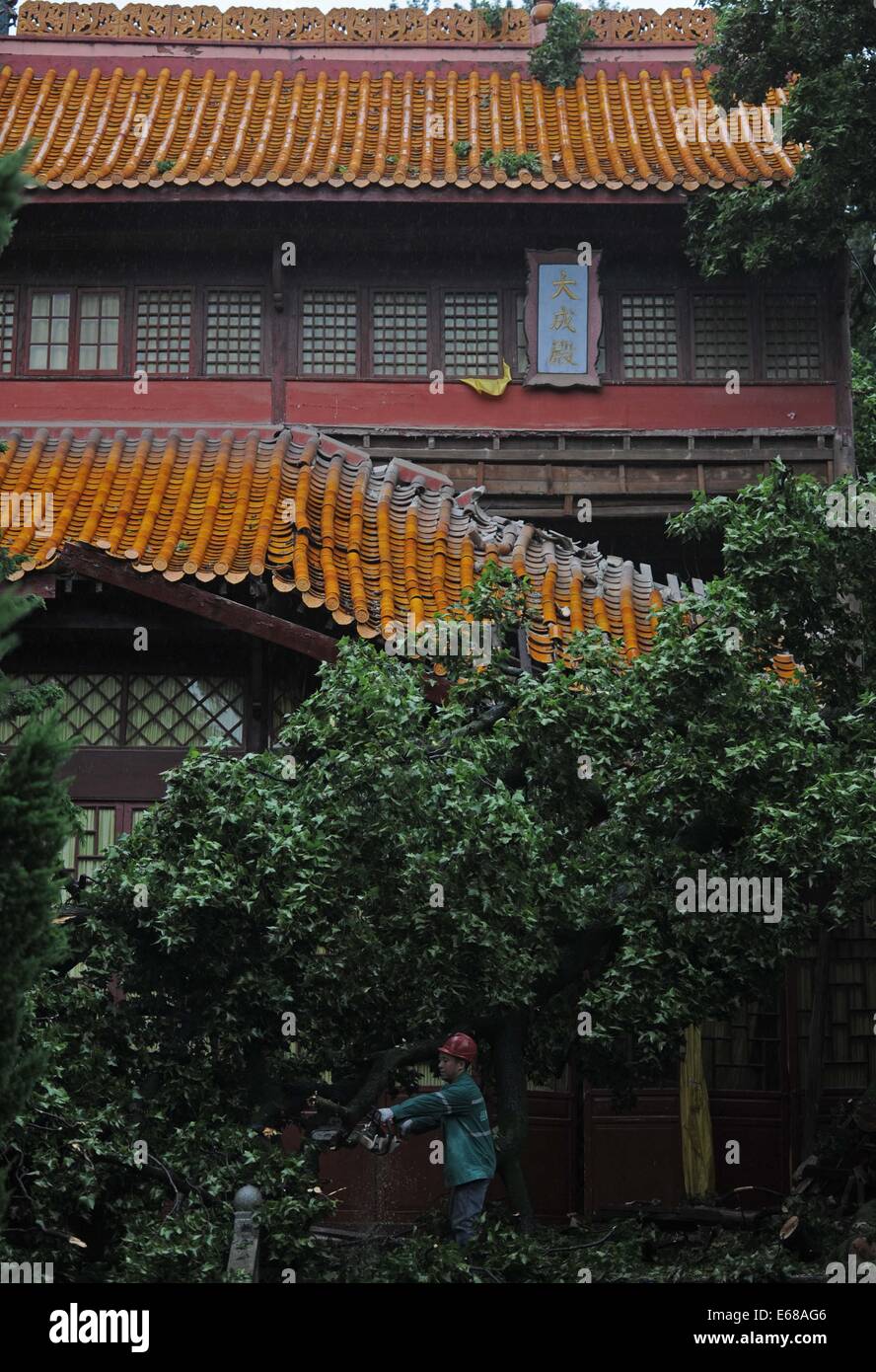 Changsha, China's Hunan Province. 18th Aug, 2014. A worker clears a ...