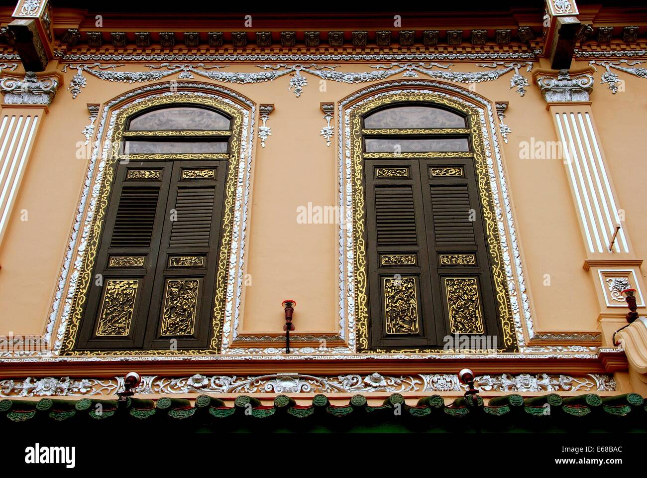 MELAKA, MALAYSIA: Swags, gilded wooden window shutters, and classical ...