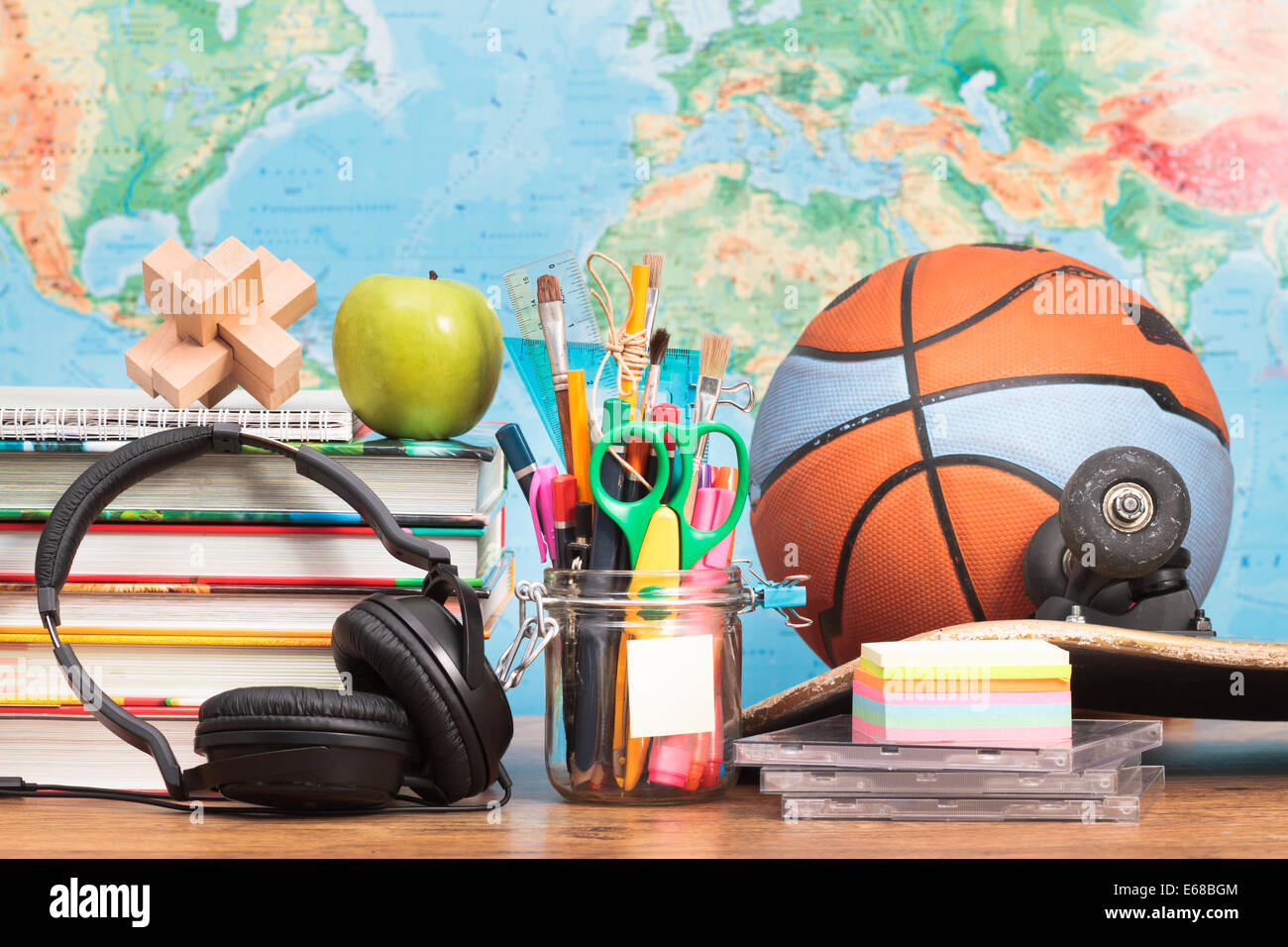 School accessories on desktop with map in the background Stock Photo ...
