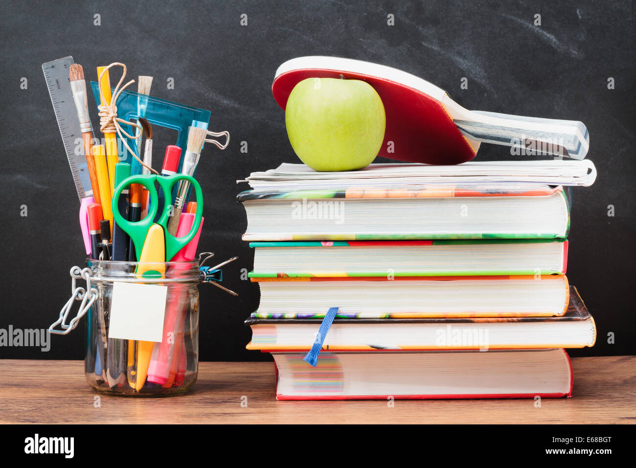 School accessories on desktop with blackboard in the background Stock ...