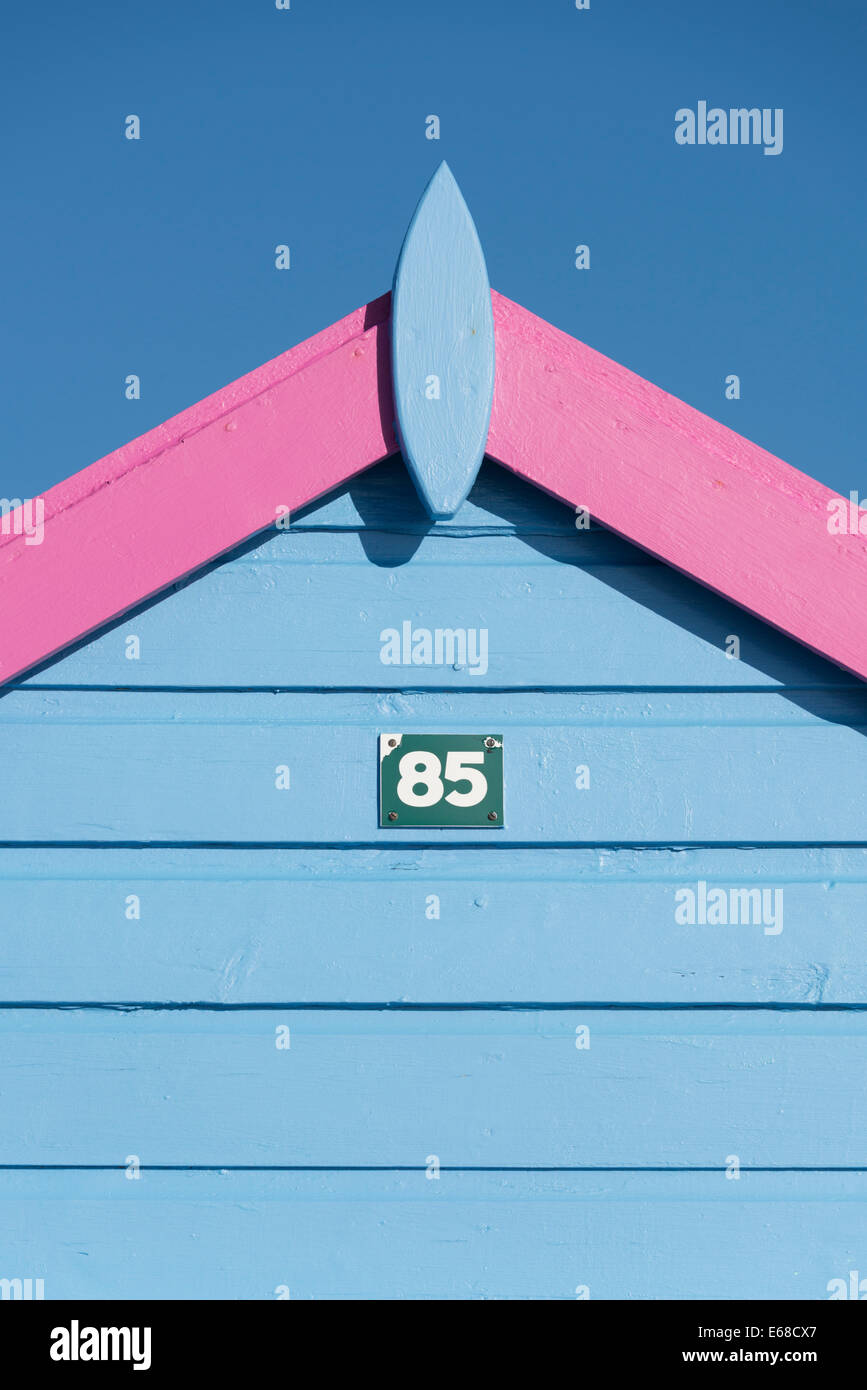 A photo of hut number 85 at West Wittering. A brightly coloured blue ...