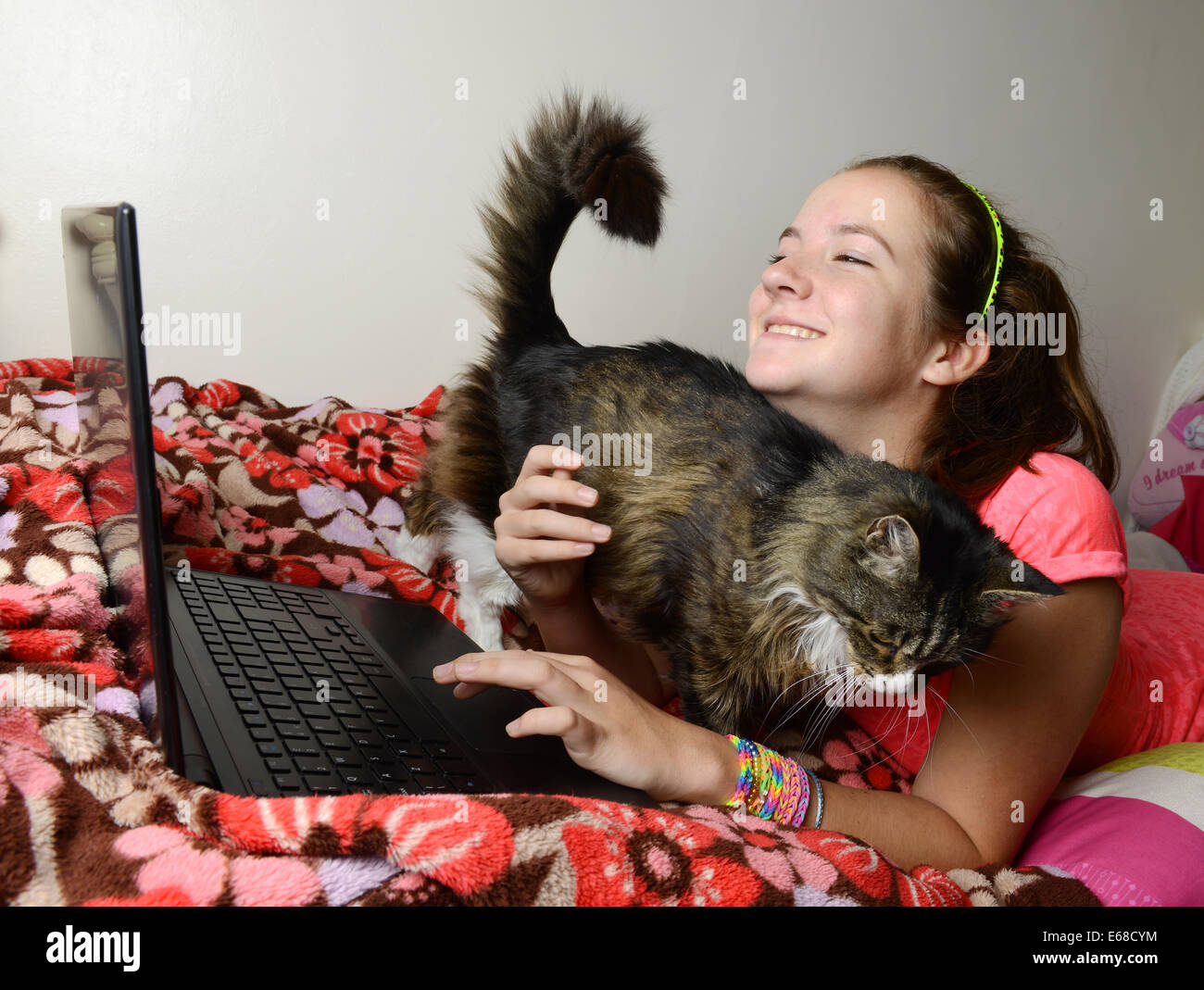 Computer laptop being used by a child in her bedroom, teenage girl ...