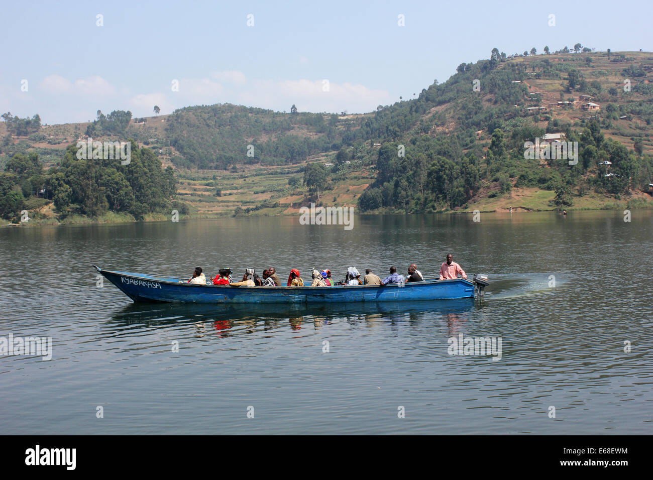 Passengers ride on a canoe on Lake Bunyonyi in Western Uganda Stock ...