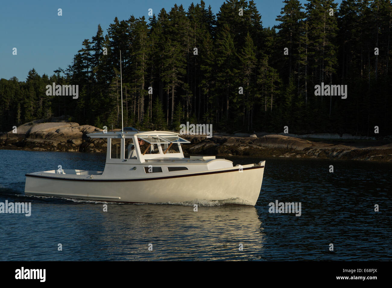 Center Harbor, Brooklin, Maine - 9 August 2014. A lobster boat heading ...