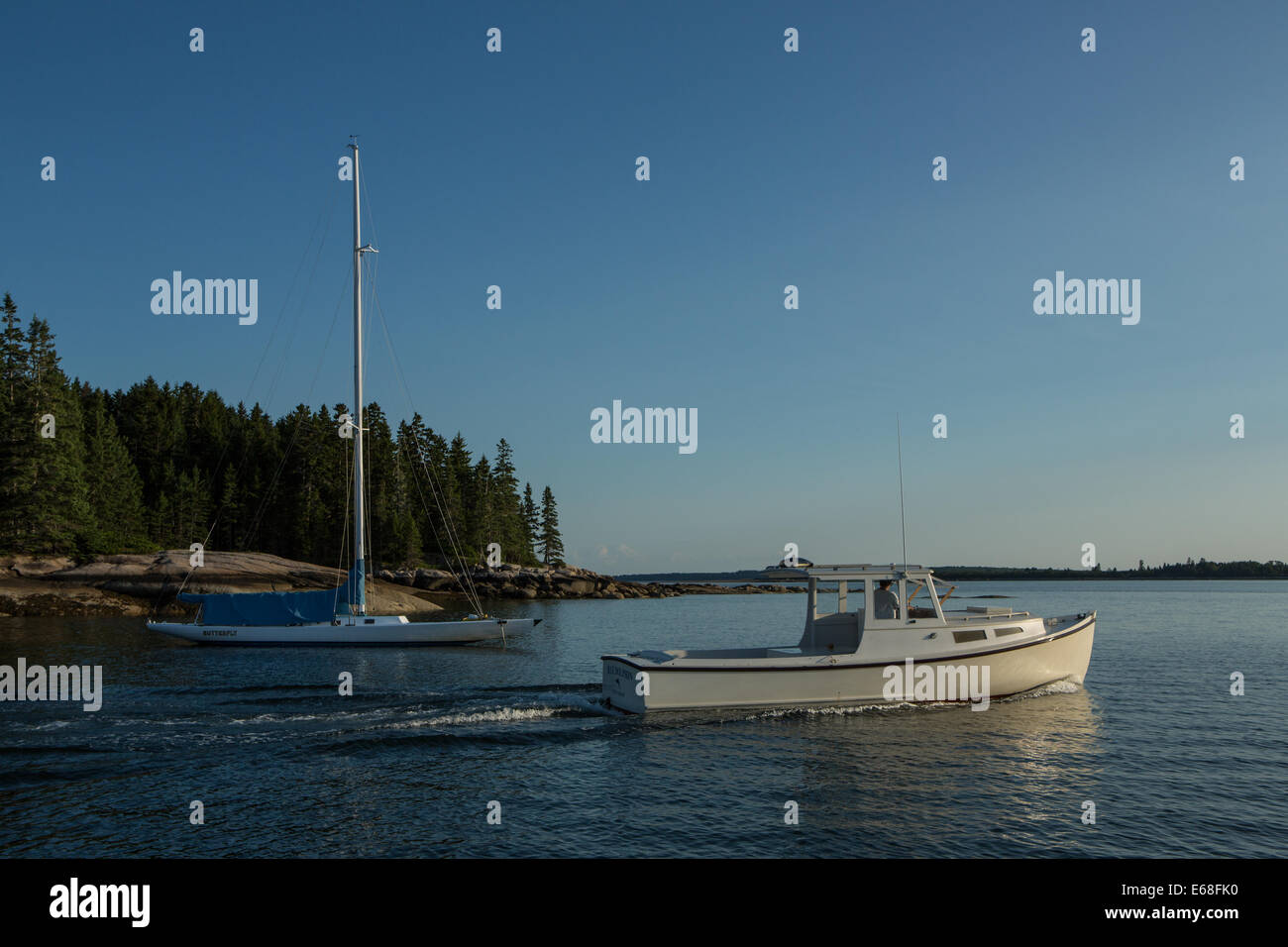 Center Harbor, Brooklin, Maine - 9 August 2014. A lobster boat heading ...