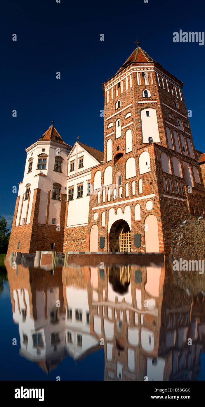 beautiful red brick castle stands in Europe.reflection in the water ...