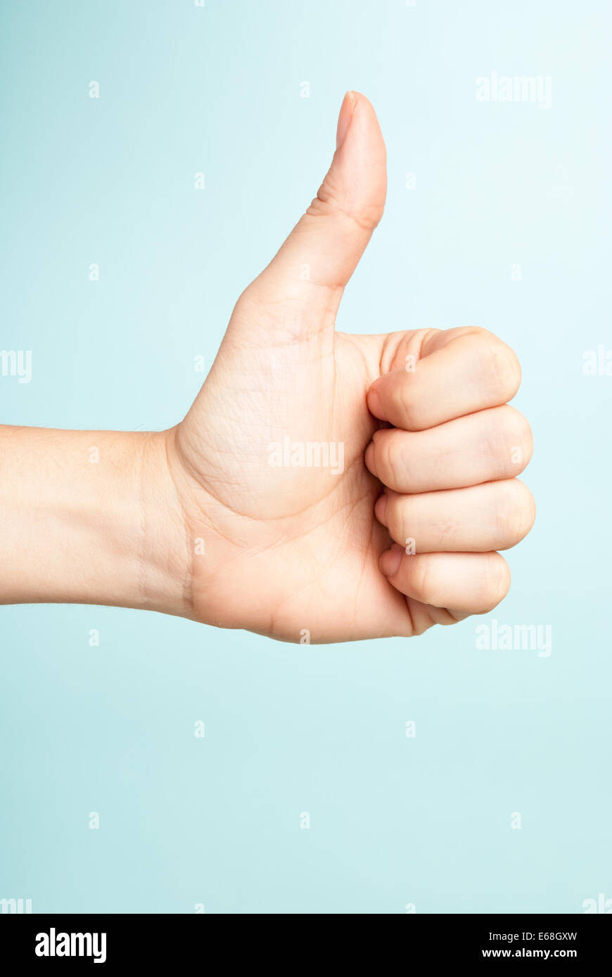 Voting hand on blue background Stock Photo - Alamy