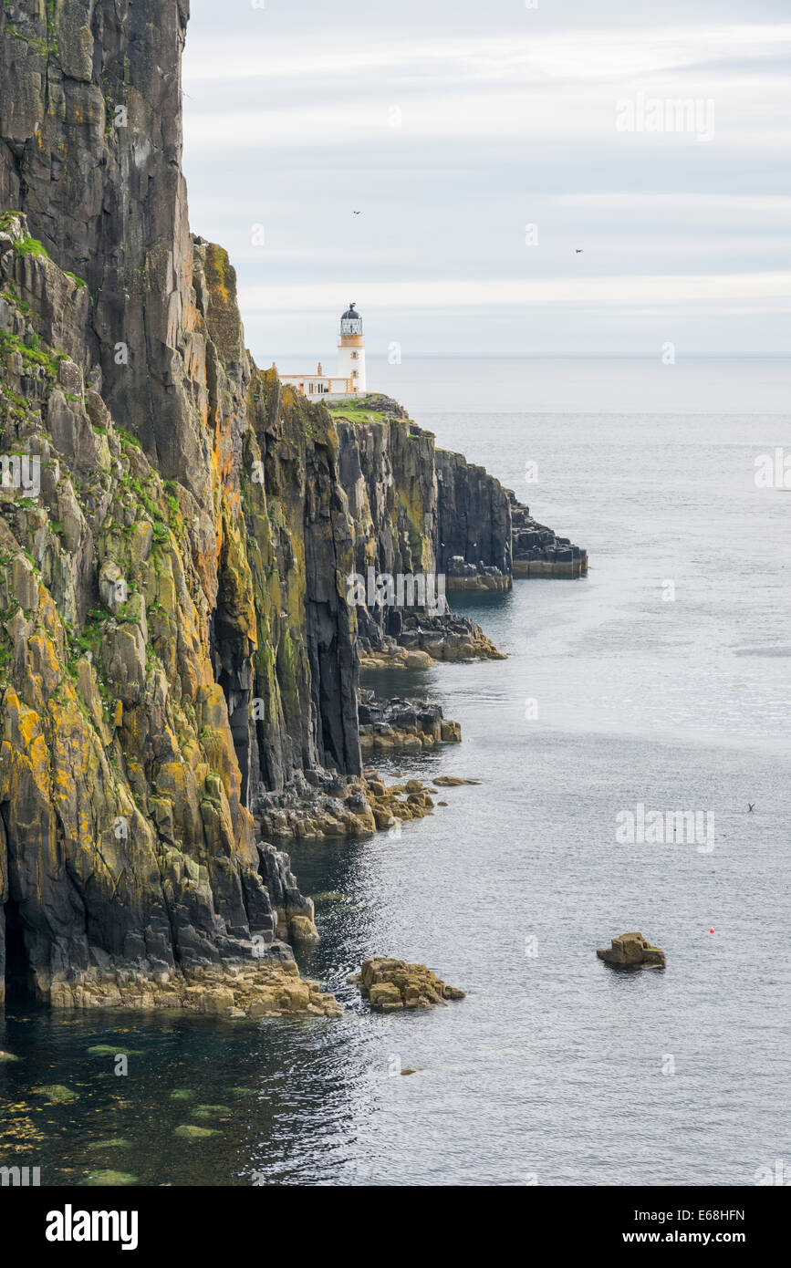 Vertical view of Neist Point lighthouse and rocky ocean coastline ...