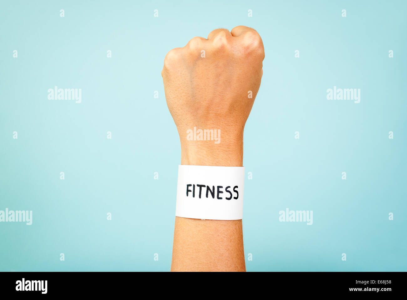 Fitness woman hand concept on blue background Stock Photo - Alamy