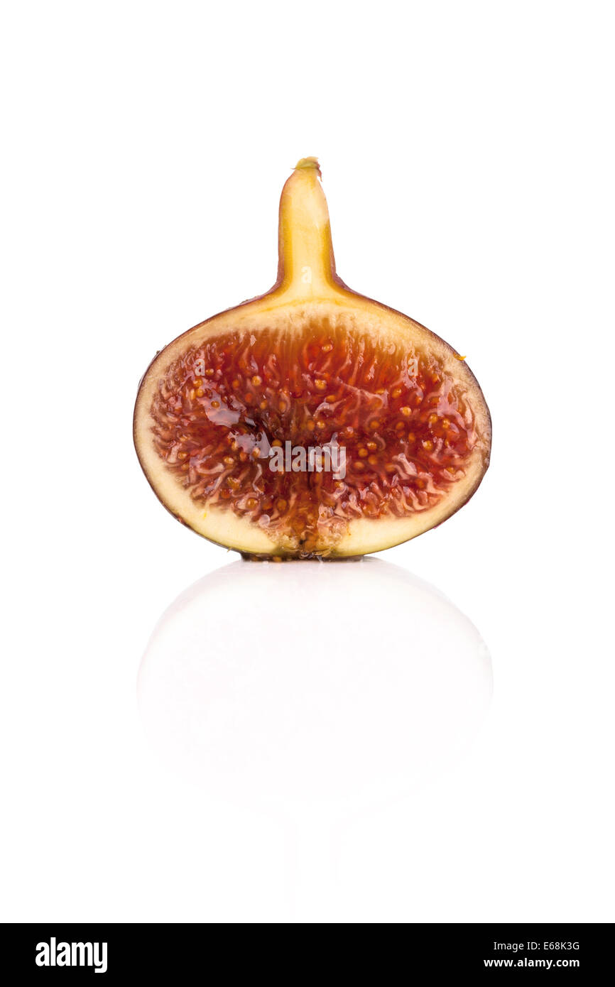 Half sliced fig isolated on white background Stock Photo - Alamy