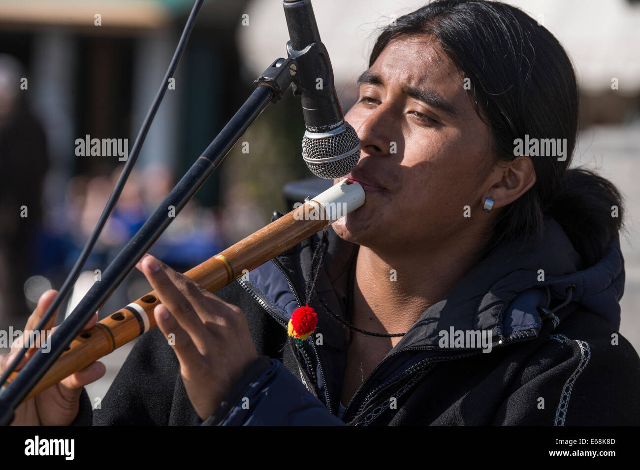 Andean flute player performs for Carnival crowds on the waterfront in ...