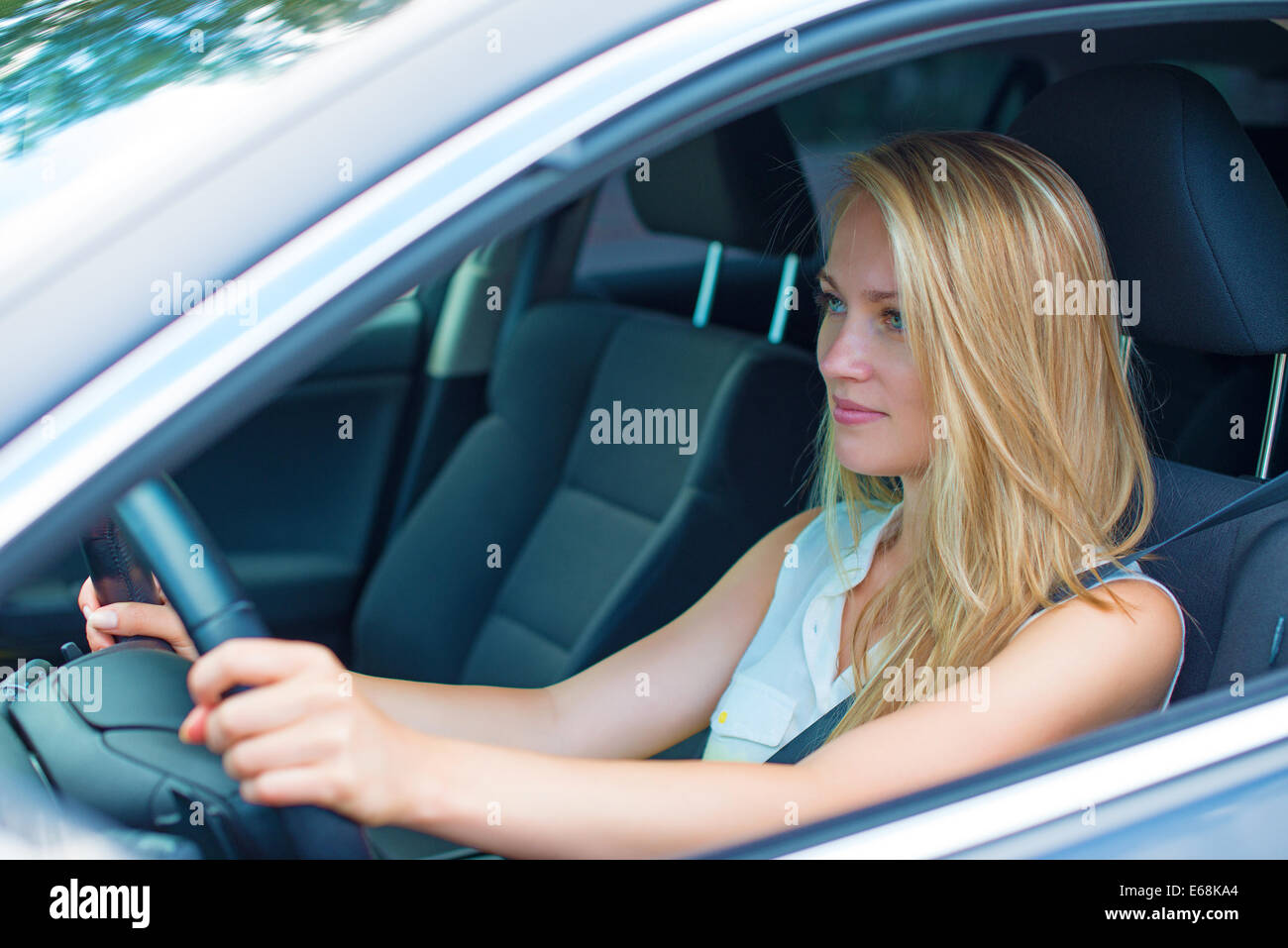 Cute girl driving car blond hi-res stock photography and images - Alamy