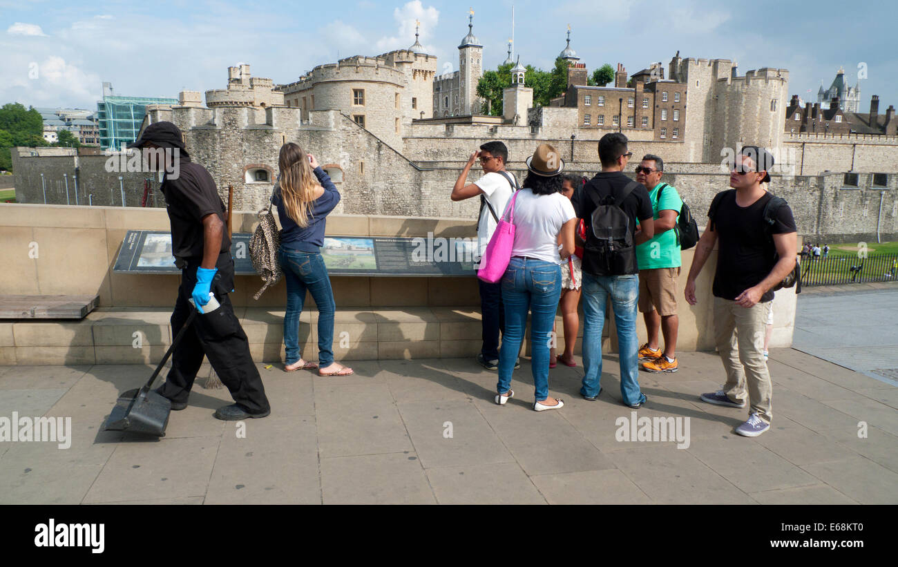 Rear view of Tourist family looking at the Tower of London buildings ...
