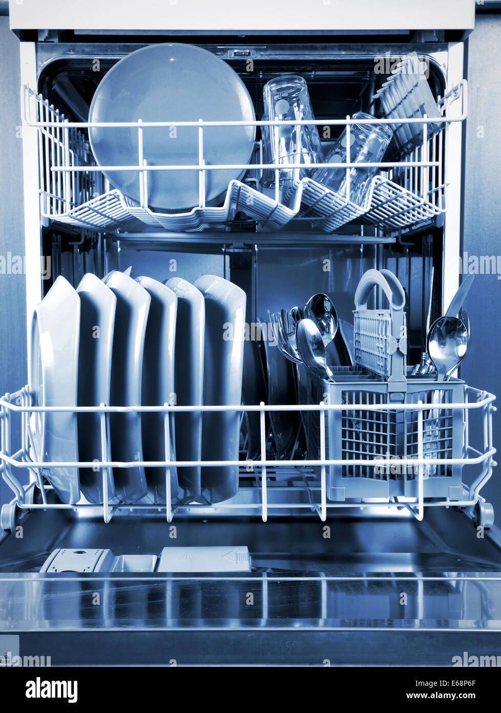Inside a dishwasher and dishes in the kitchen Stock Photo - Alamy