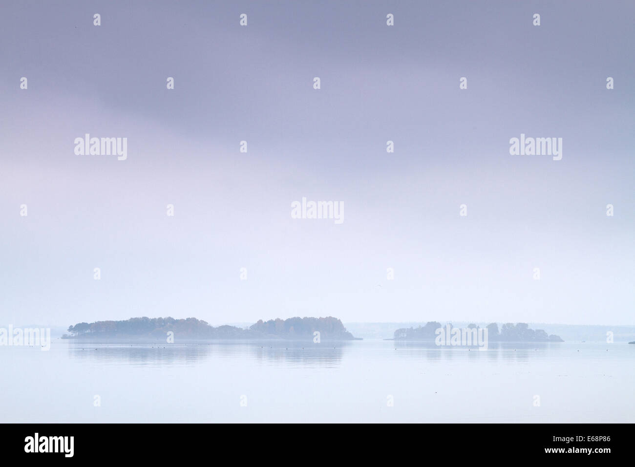 fog over the sea and the island Stock Photo - Alamy
