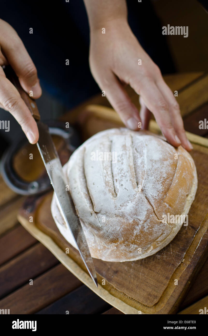 Hands cutting homemade country hi-res stock photography and images - Alamy