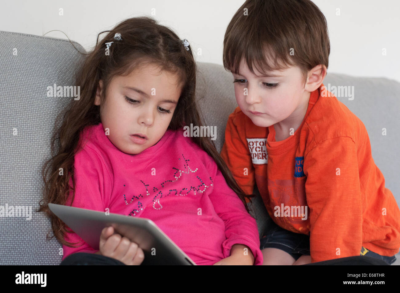 Children use gadgets hi-res stock photography and images - Alamy