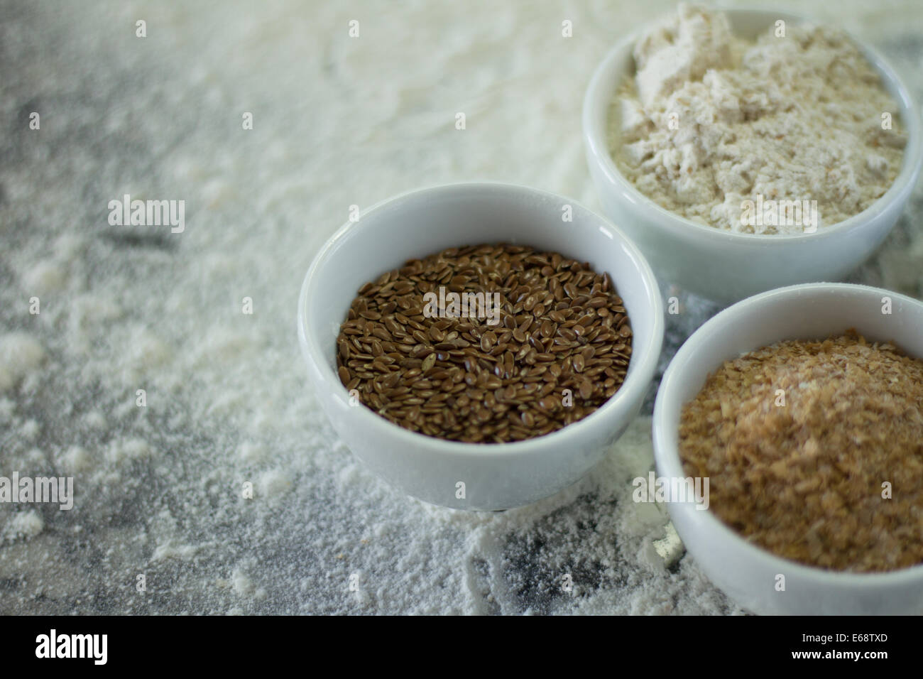 Ceramic pots with flour and seeds over a floured background Stock Photo ...