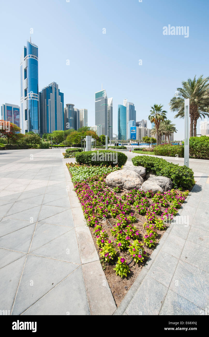 Small park garden palm trees downtown skyline cityscape buildings of ...