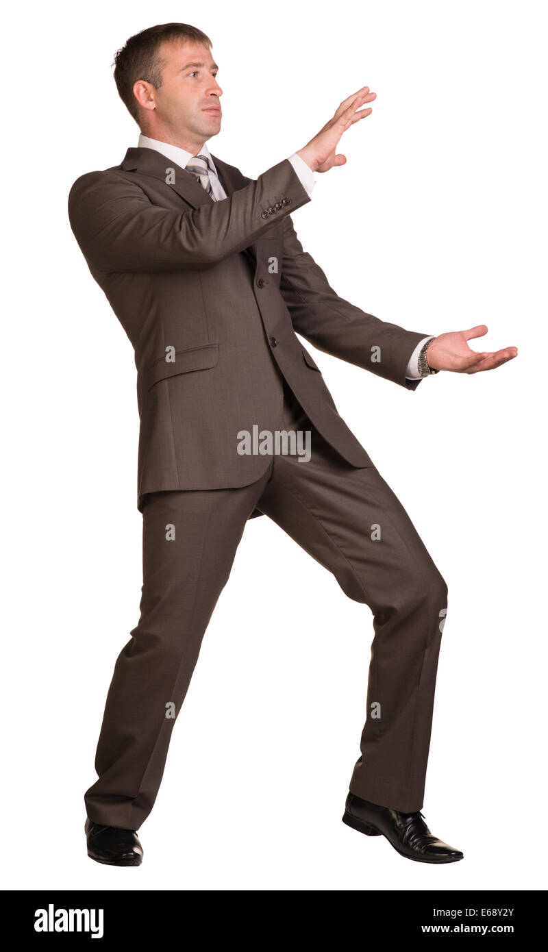 Businessman holding hands in front of him Stock Photo - Alamy