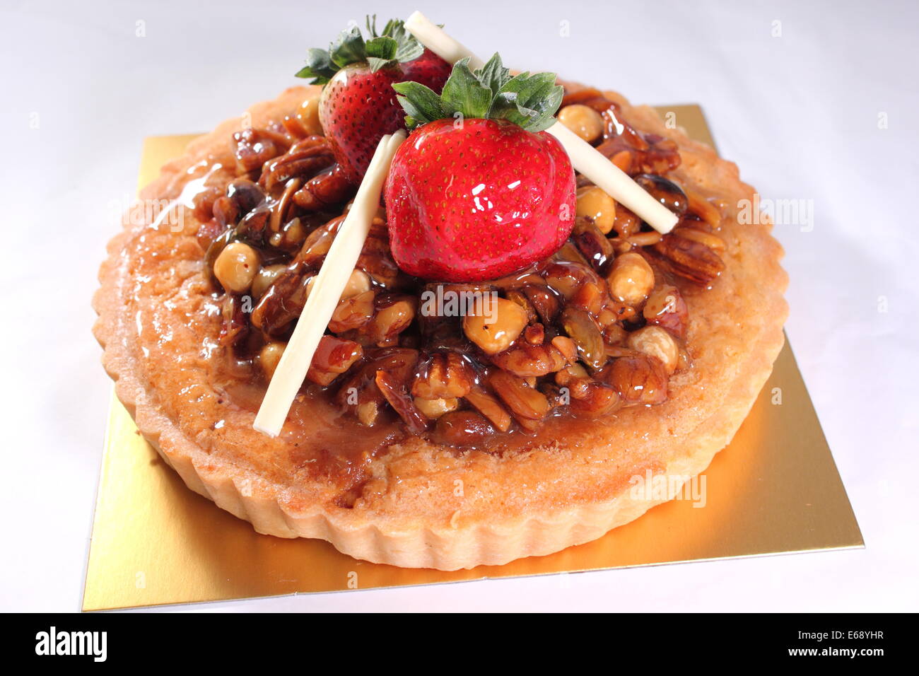 A Mixed nuts pie decorated with strawberry Stock Photo - Alamy