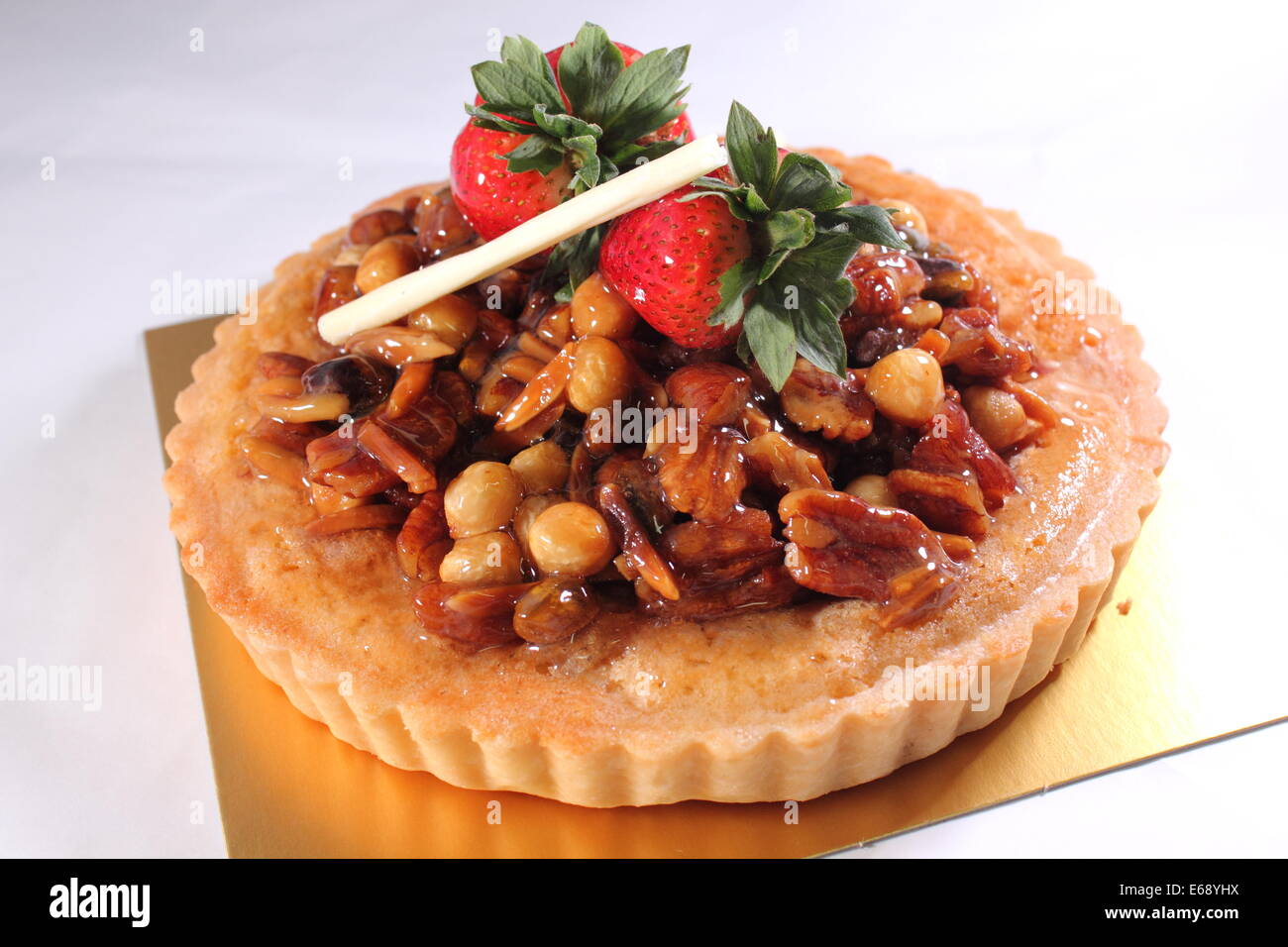 A Mixed nuts pie decorated with strawberry Stock Photo - Alamy