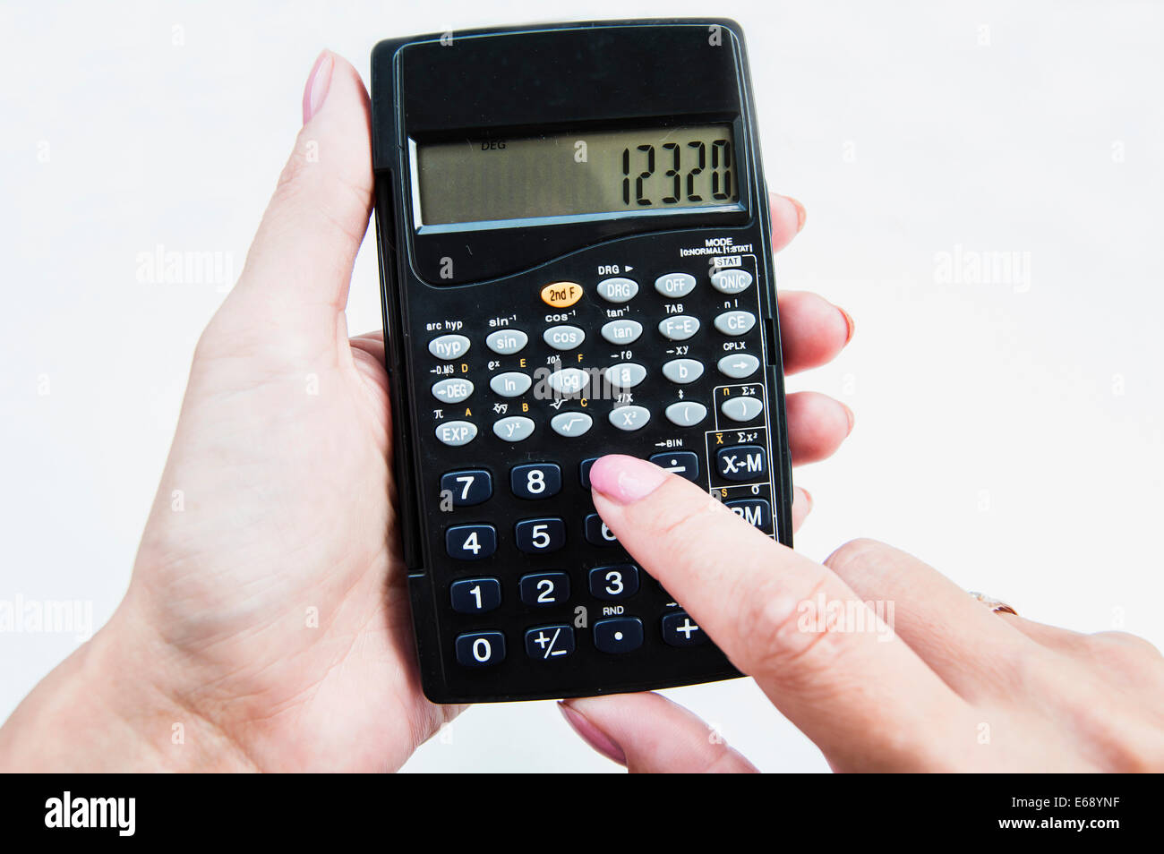 Calculator in hand Stock Photo - Alamy