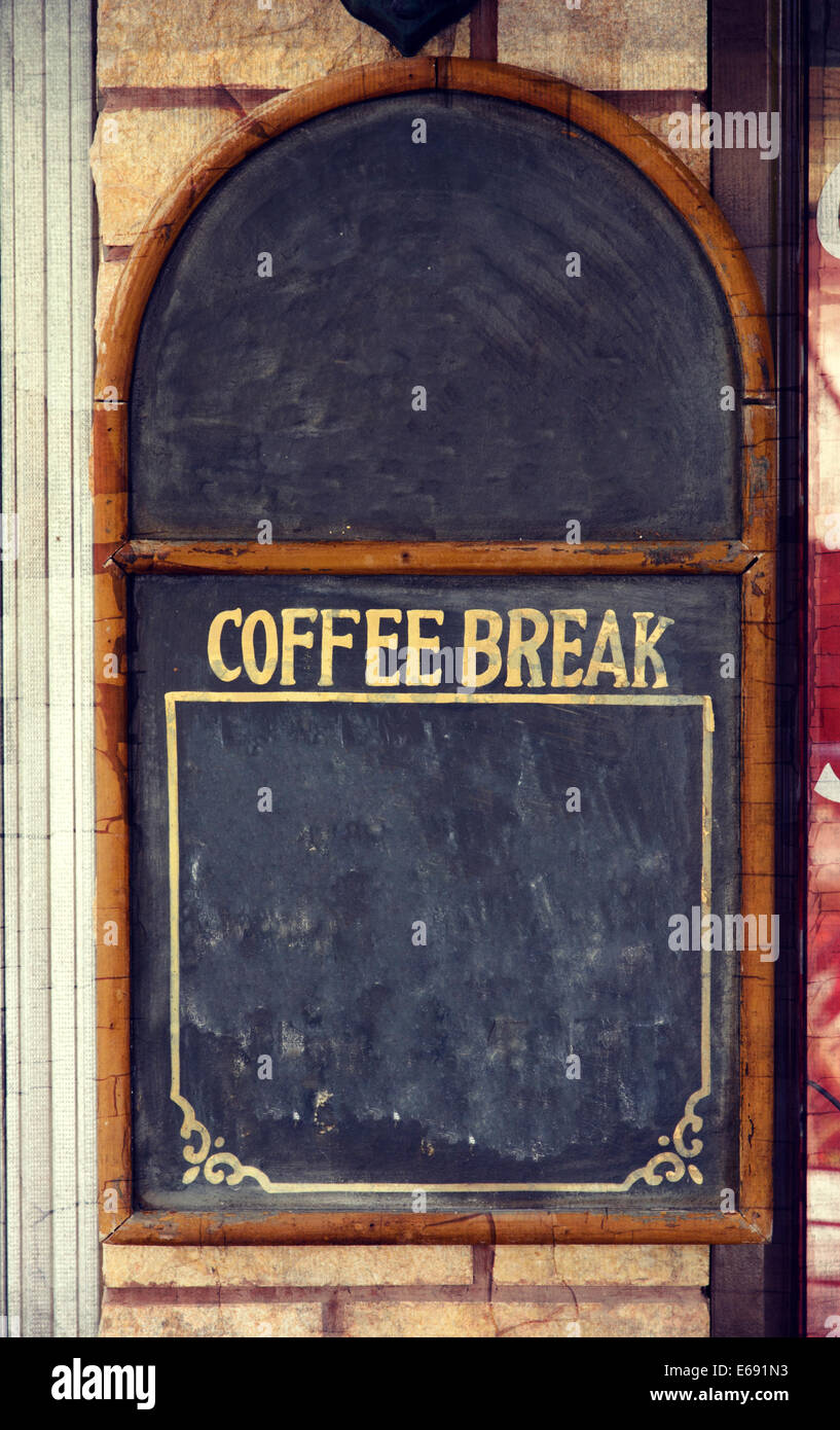 Coffee break blank chalk board on the wall Stock Photo - Alamy