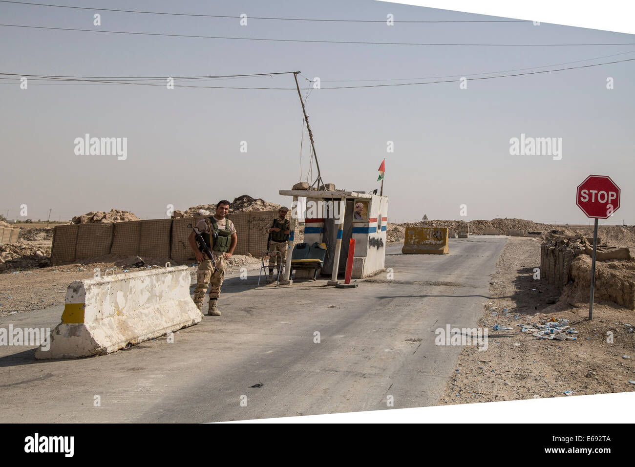 Makhmour, Northern Iraq. 18th Aug, 2014. Two peshmerga soldiers man the ...