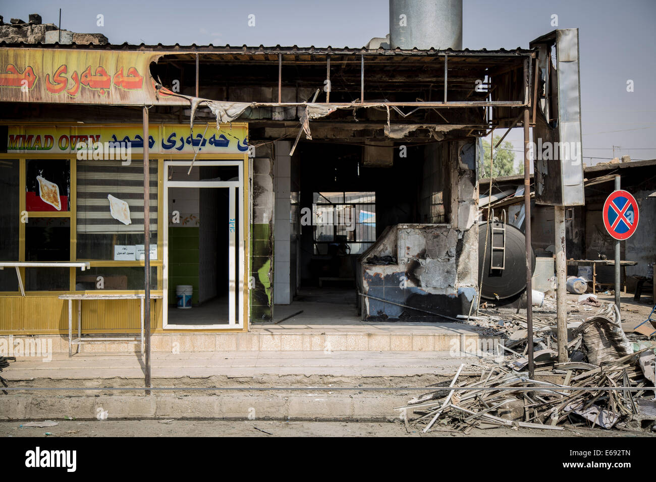 Makhmour, Northern Iraq. 18th Aug, 2014. A bakery has been burned down ...