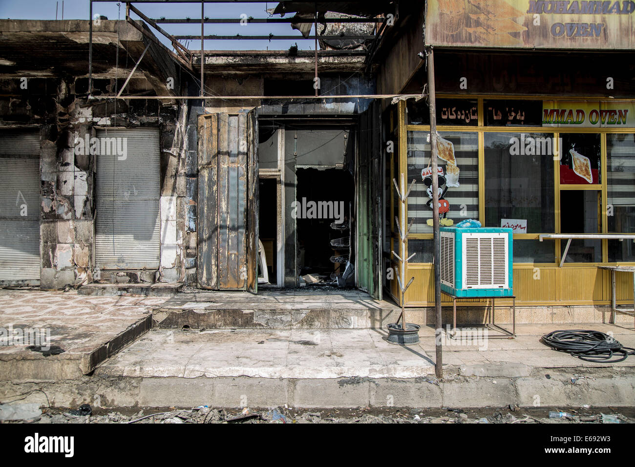 Makhmour, Northern Iraq. 18th Aug, 2014. A bakery has been burned down ...