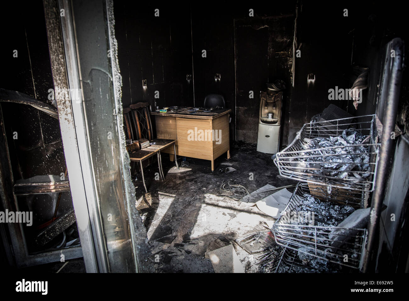 Makhmour, Northern Iraq. 18th Aug, 2014. A shop has been burned down by ...