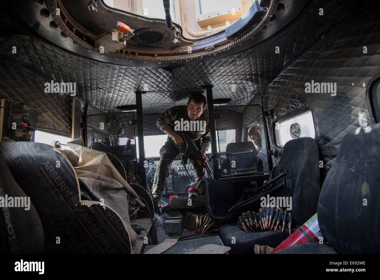 Makhmour, Northern Iraq. 18th Aug, 2014. A Peshmerga fighter is seen ...