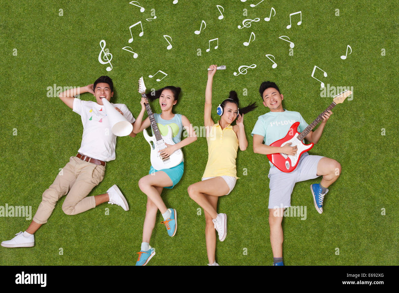Young people on grass playing musical instruments Stock Photo - Alamy