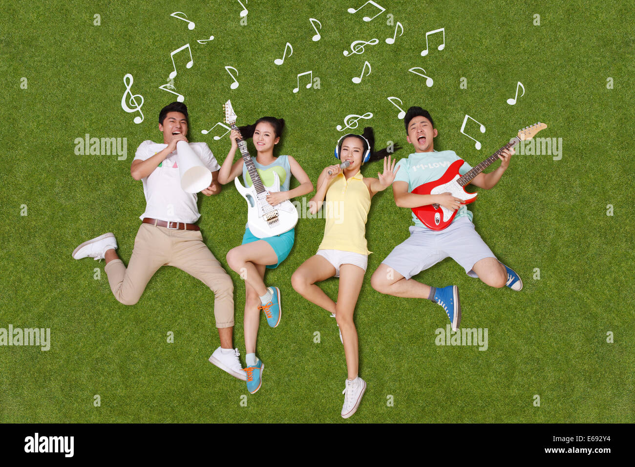 Young people on grass playing musical instruments Stock Photo - Alamy