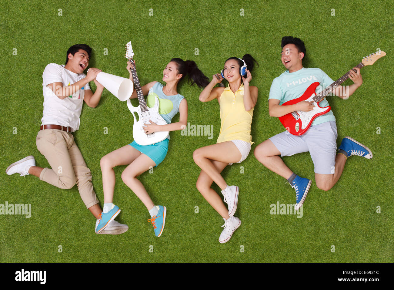 Young people on grass playing musical instruments Stock Photo - Alamy