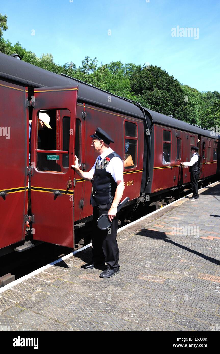 Porters alongside the LMS/British Rail Maroon railway carriages ready ...