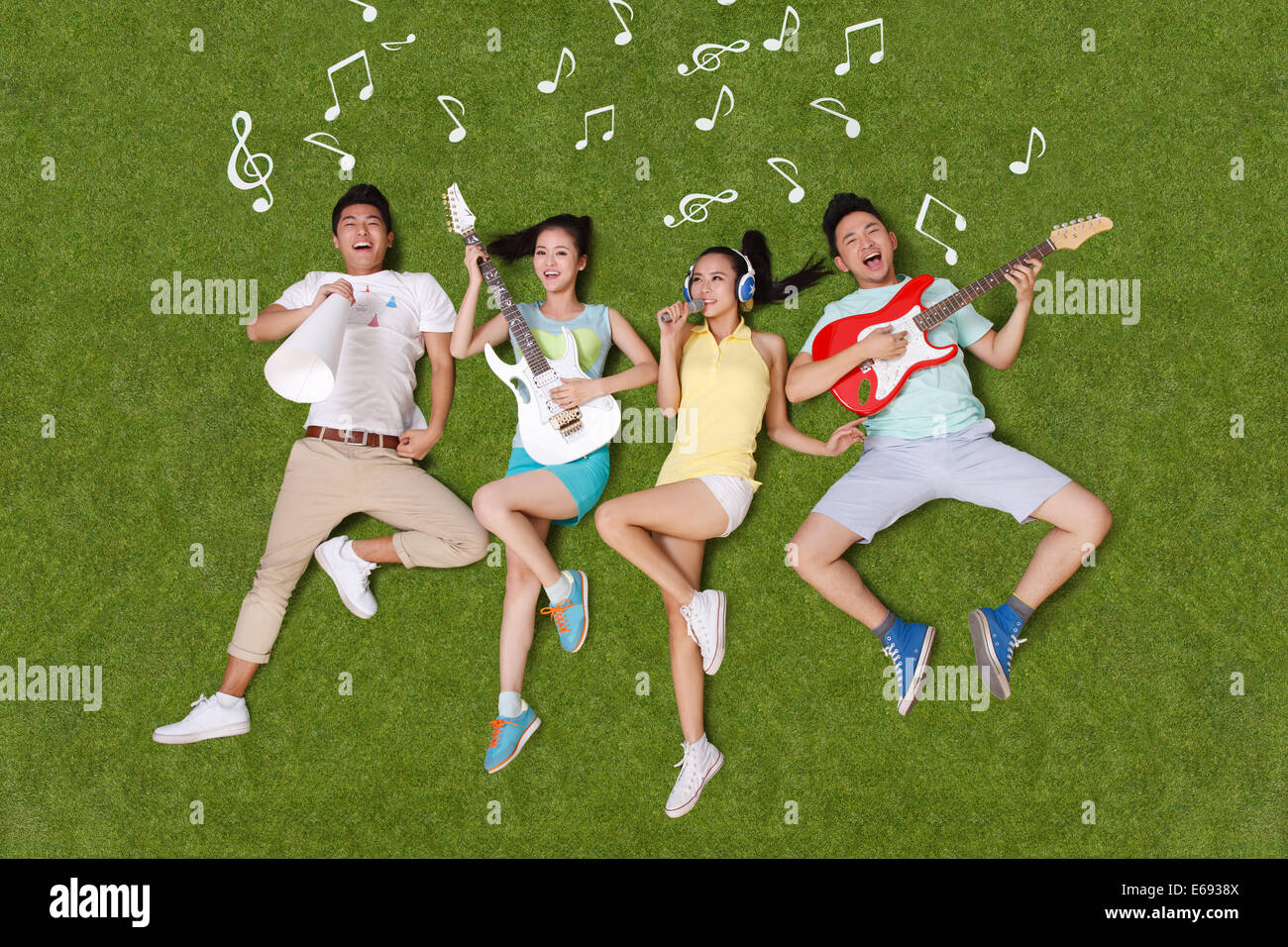 Young people on grass playing musical instruments Stock Photo - Alamy