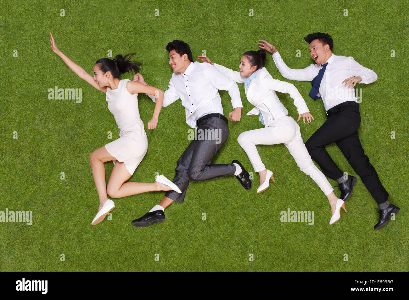 Young people on grass Stock Photo - Alamy