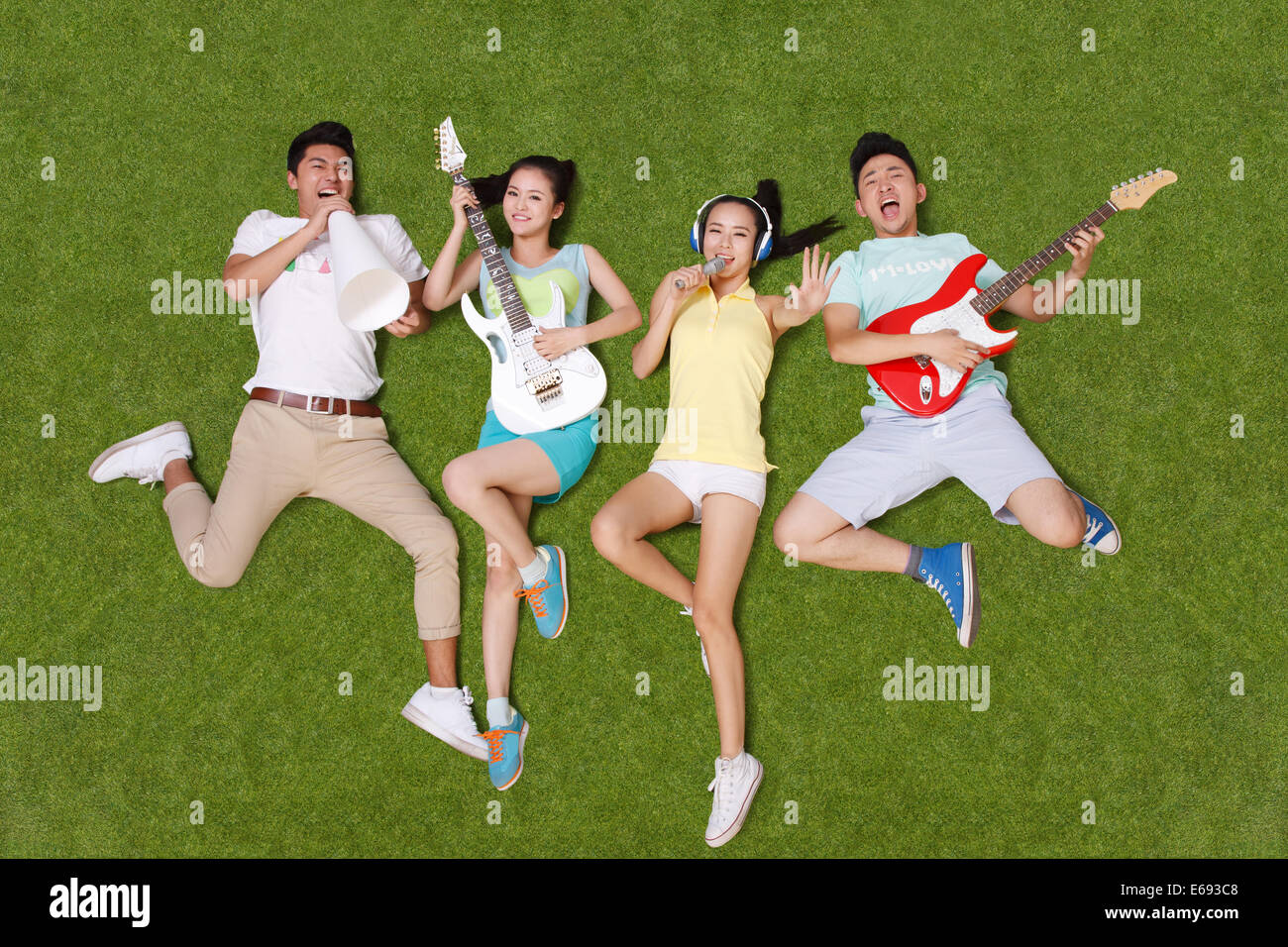Young people on grass playing musical instruments Stock Photo - Alamy