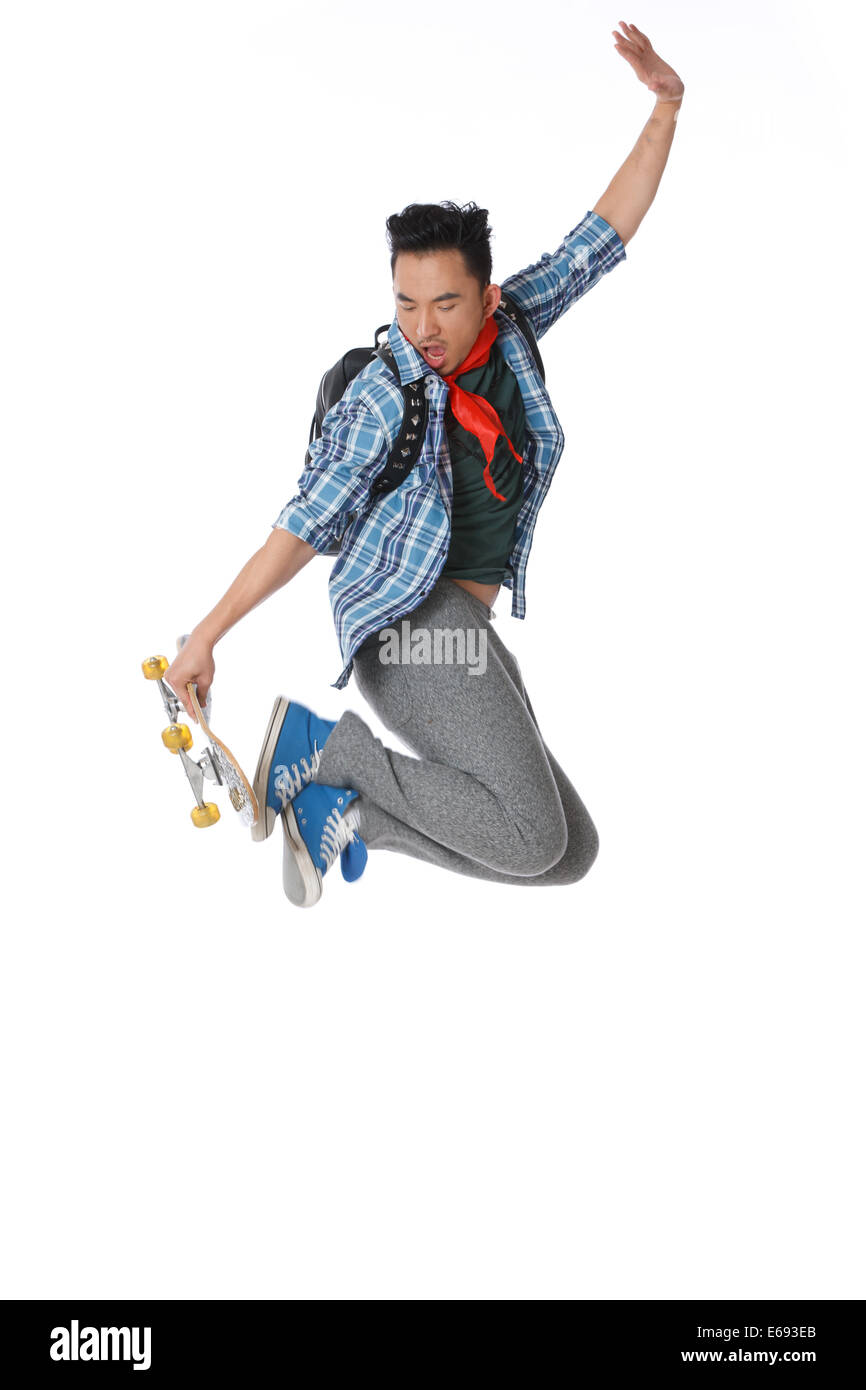 Young man playing skateboard Stock Photo - Alamy