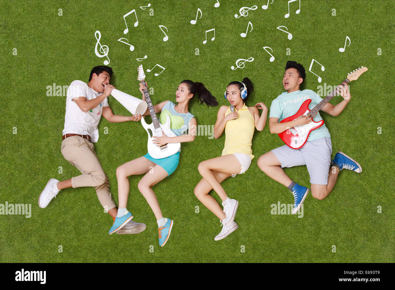 Young people on grass playing musical instruments Stock Photo - Alamy