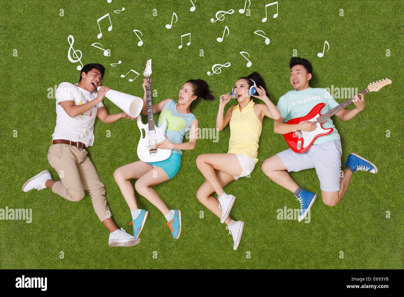 Young people on grass playing musical instruments Stock Photo - Alamy