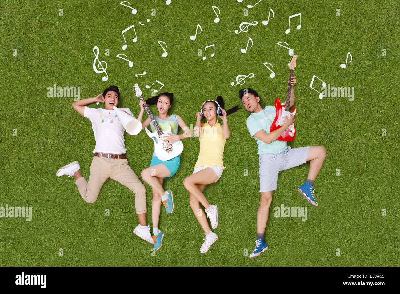 Young people on grass playing musical instruments Stock Photo - Alamy