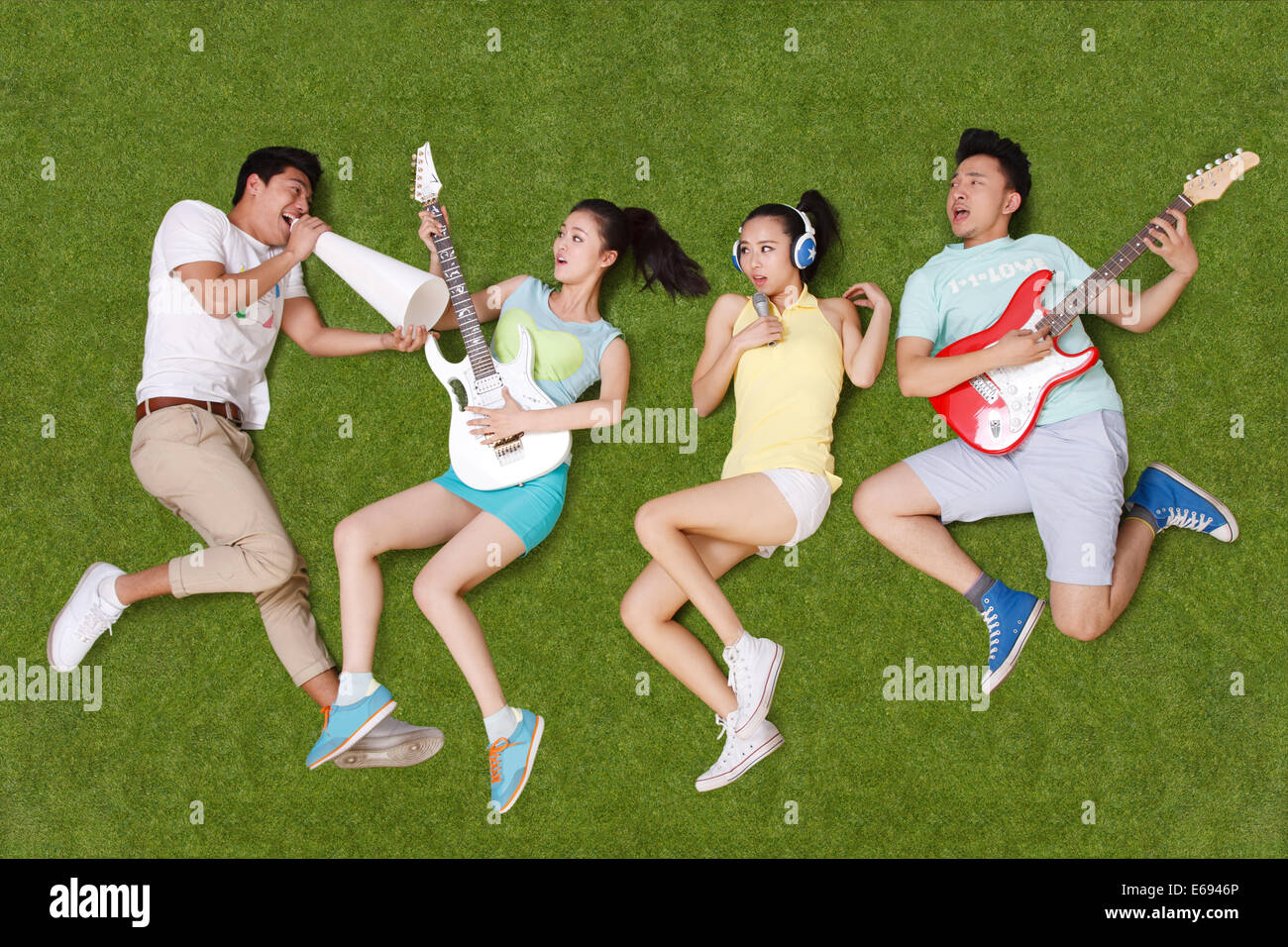 Young people on grass playing musical instruments Stock Photo - Alamy