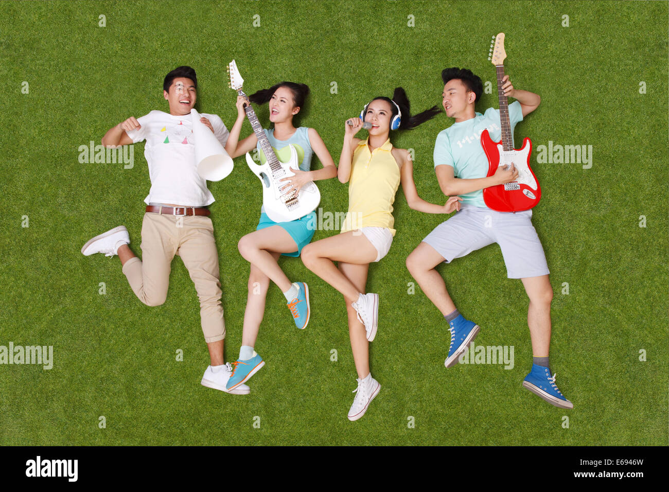 Young people on grass playing musical instruments Stock Photo - Alamy